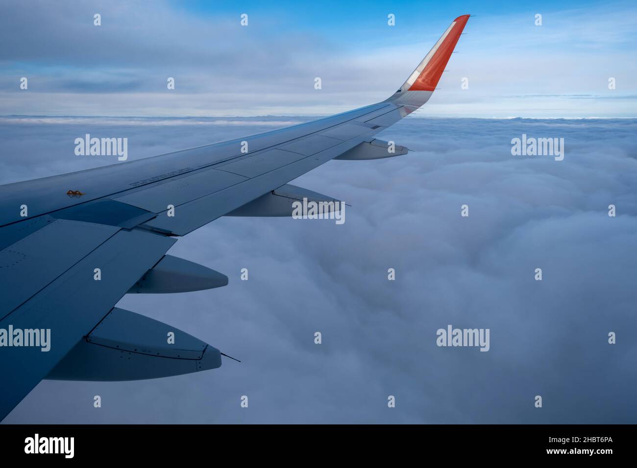 Classic image through aircraft window onto wing. Flight view over ...
