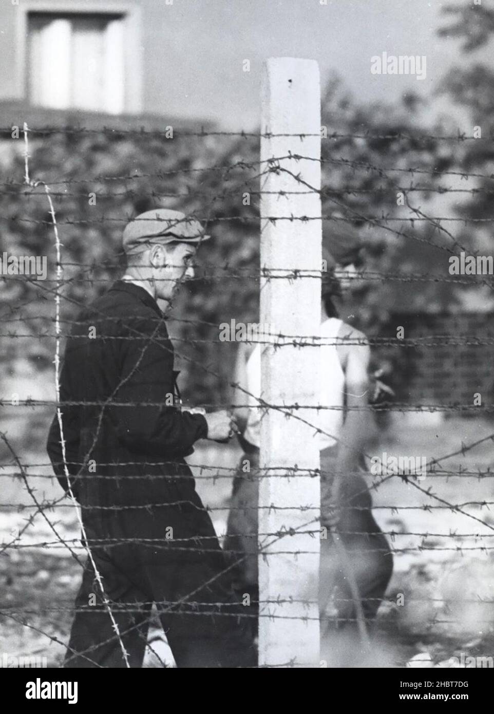 Oct. 5, 1961. An East German civilian carries bugging devices and ...