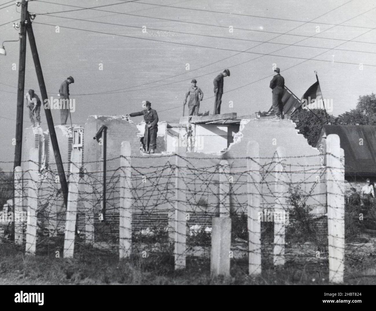 October 1961. Workers demolish East German houses in the new border ...