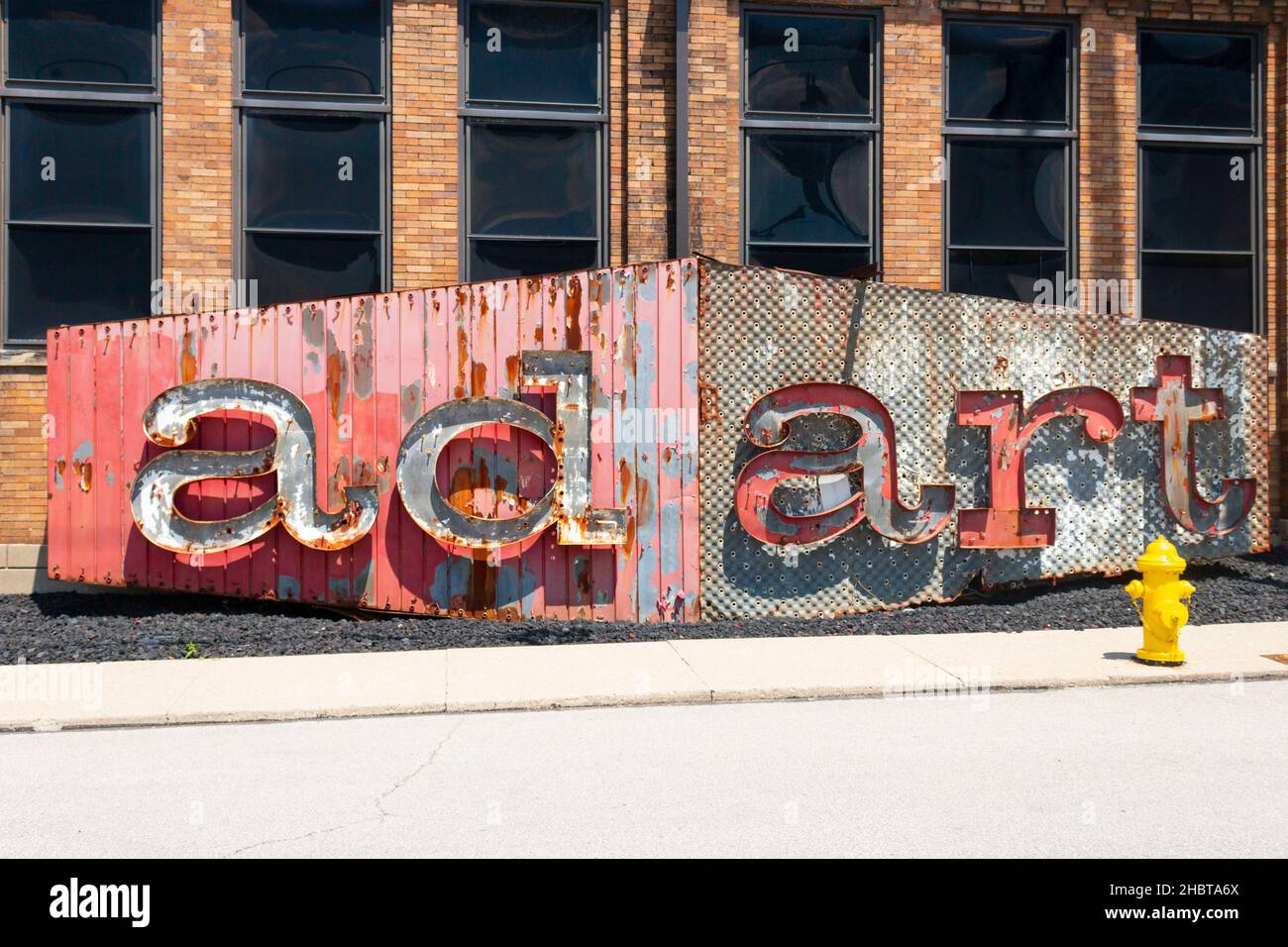 old ad art sign with red metal letters Stock Photo - Alamy