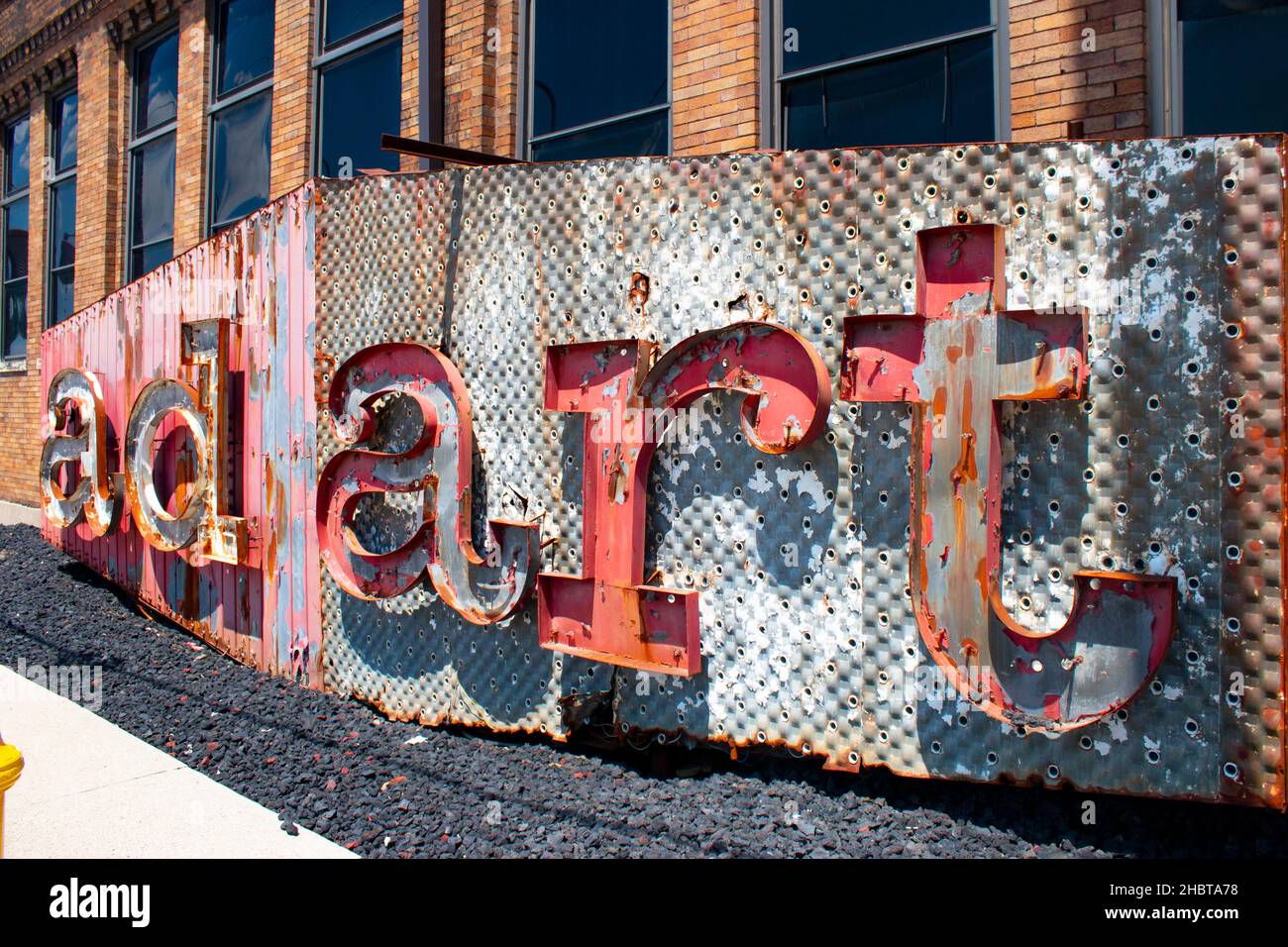 old ad art sign with red metal letters Stock Photo - Alamy