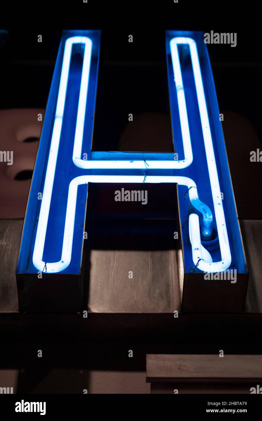 blue illuminated neon signs of letter capital A Stock Photo - Alamy