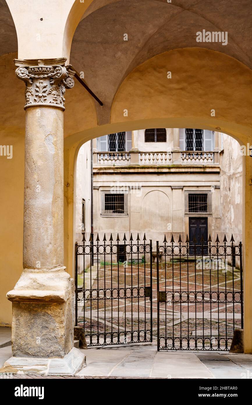 Columns with stucco molding in the arched corridor of the courtyard of ...