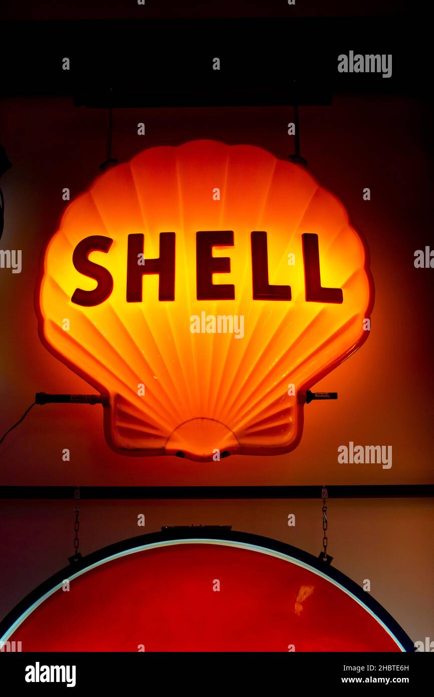 multicoloured illuminated glass logo signs for Shell Oi Stock Photo - Alamy