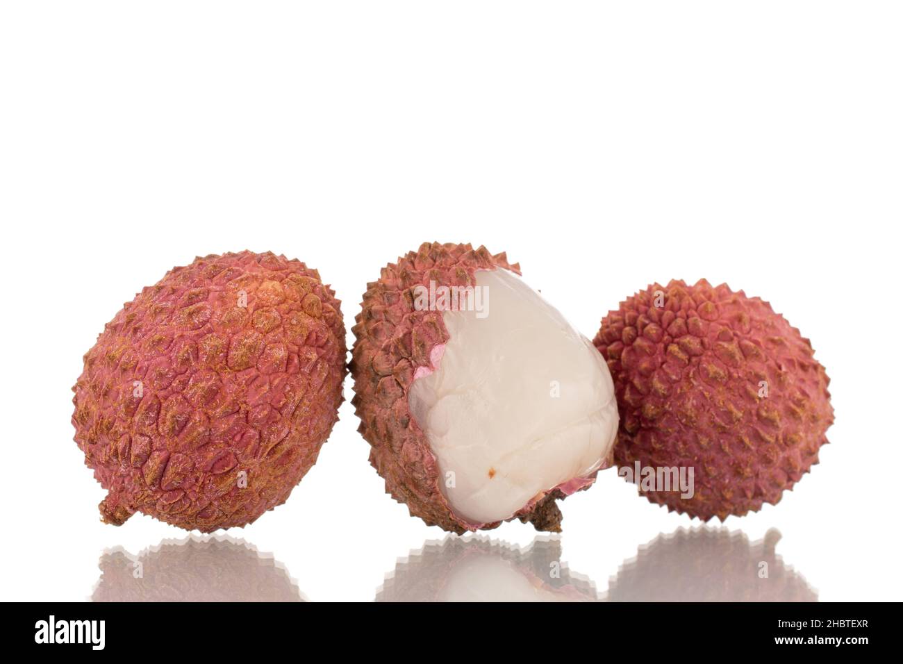 Three ripe organic litchi fruit, close-up, isolated on white Stock ...