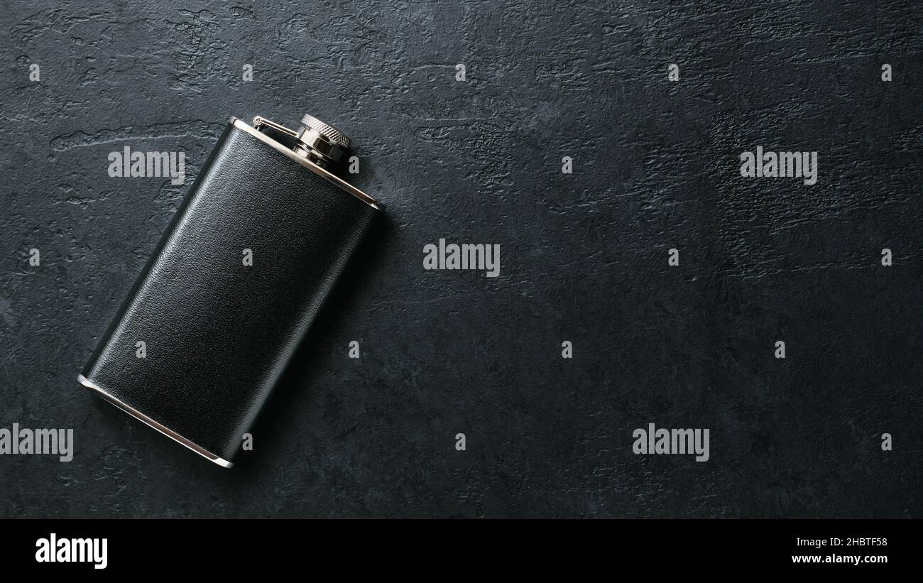 Pocket steel flask in leather trim for travel on the dark ...