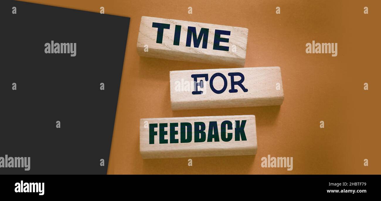 Time fir feedback text on wooden blocks. Product or service evaluation ...