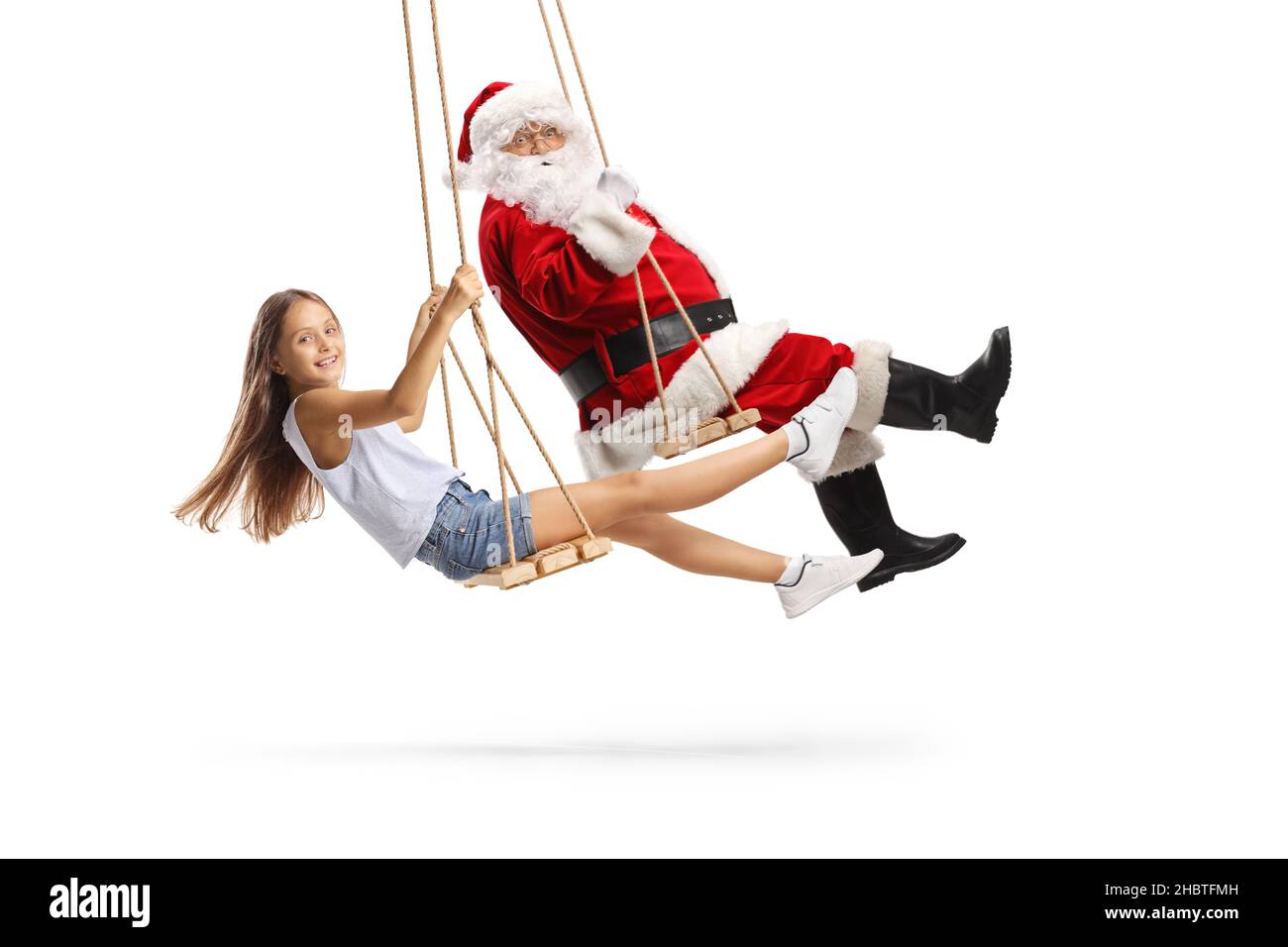 Santa claus and a happy girl swinging on wooden swings isolated on ...