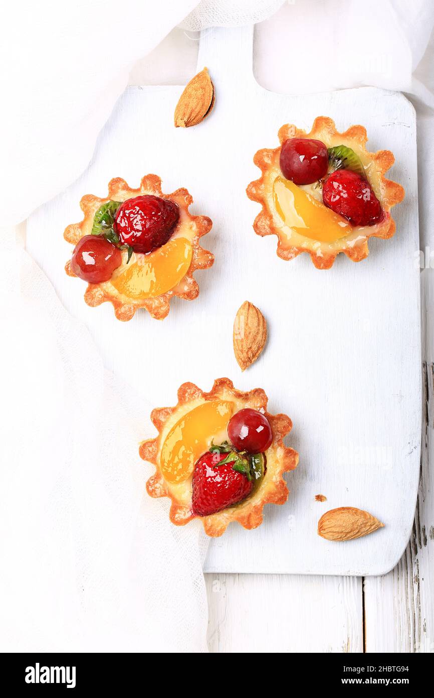 almond cake with berries on white background Stock Photo - Alamy