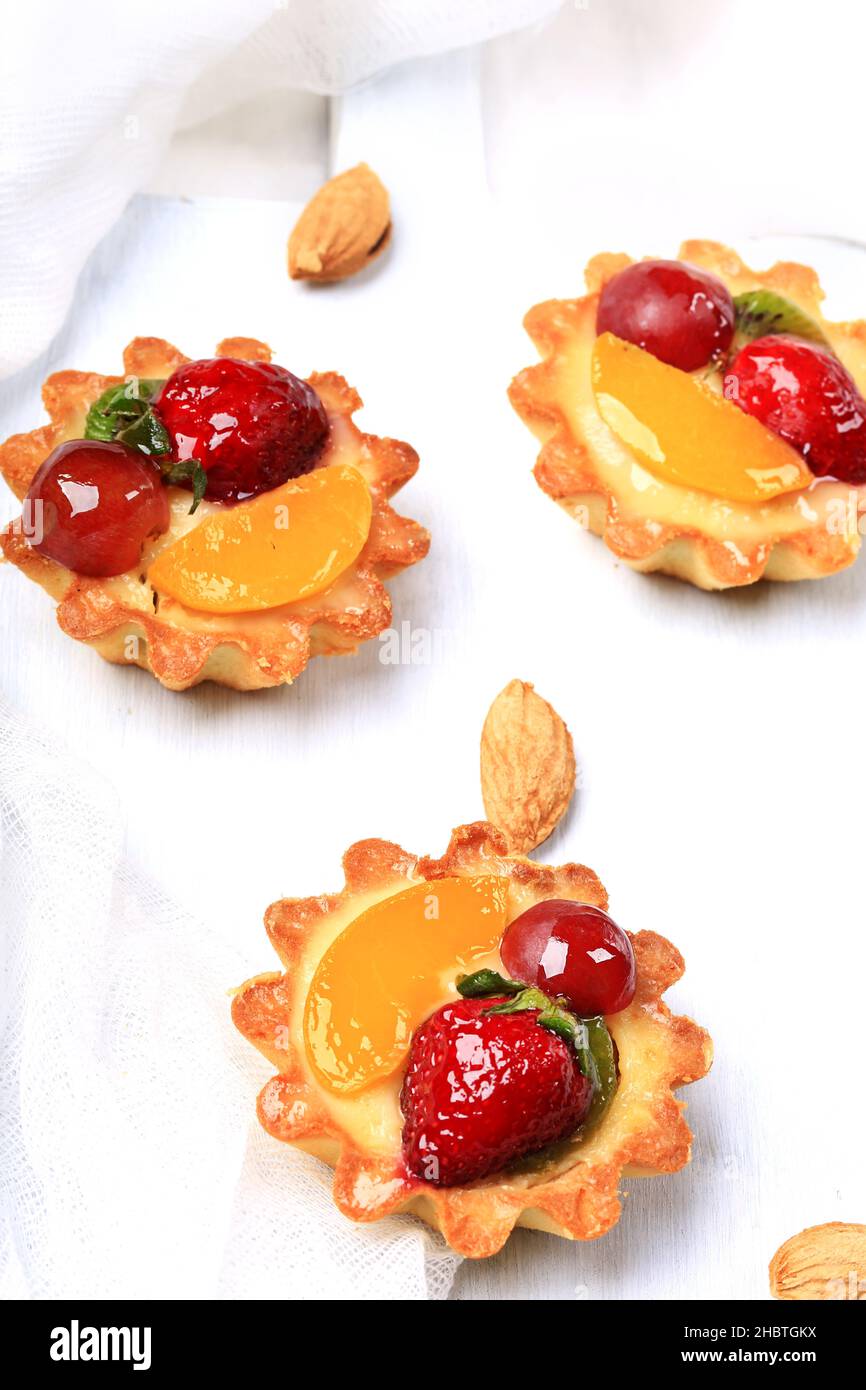 almond cake with berries on white background Stock Photo - Alamy