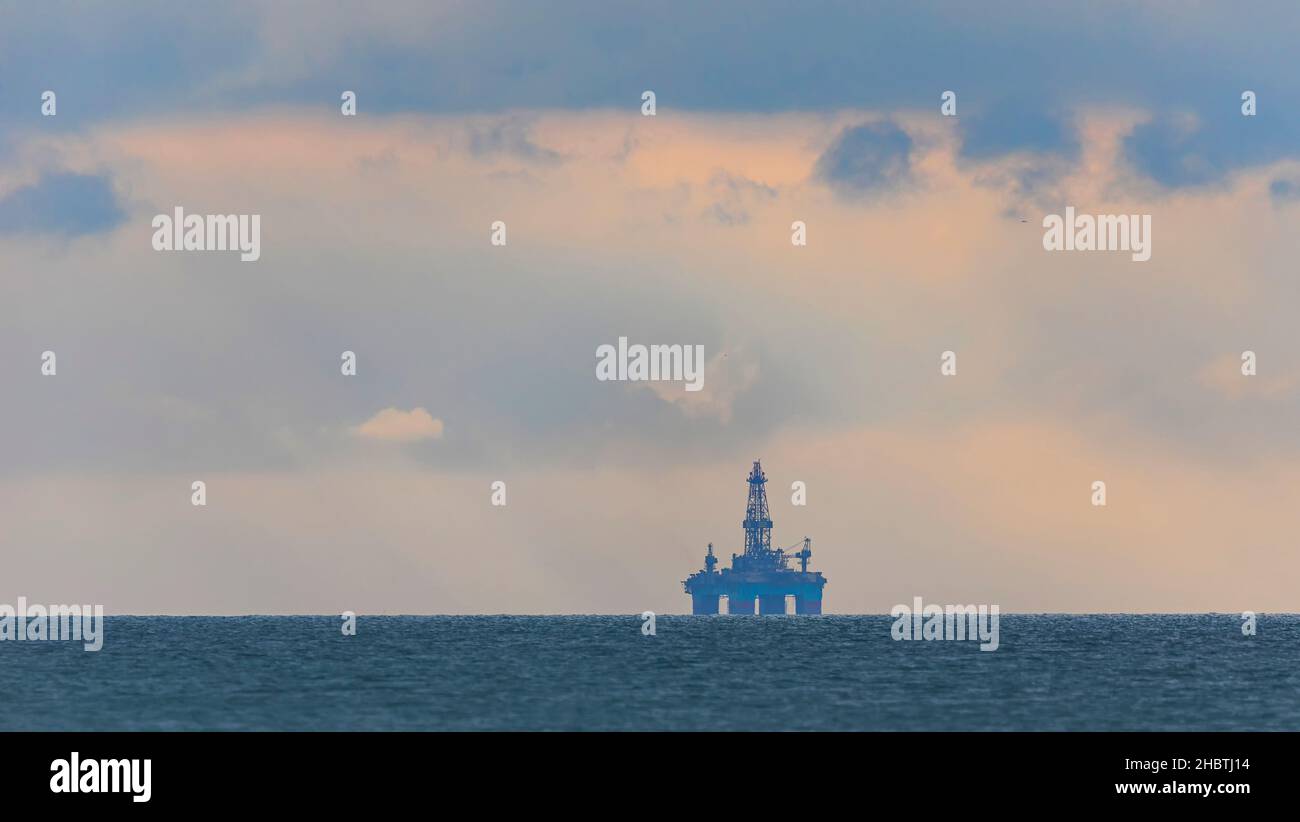 Deepwater oil platform on the horizon at sea Stock Photo - Alamy