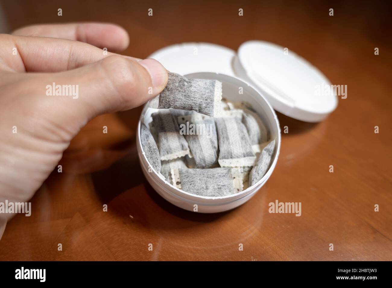 Snus, moist powder tobacco product widely consumed in Norway and Sweden ...