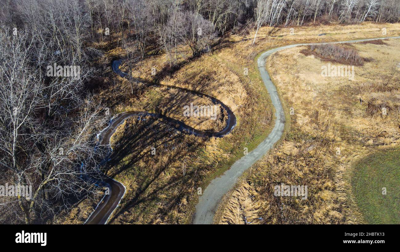 Hiking trail with stream alongside it in autumn woods Stock Photo - Alamy