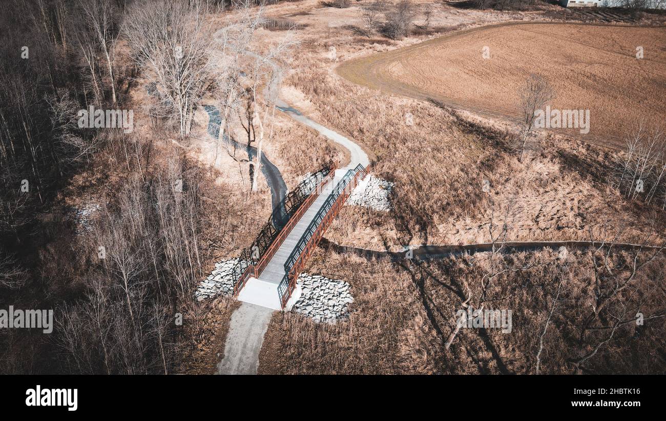 Stream flows under a footbridge hi-res stock photography and images - Alamy