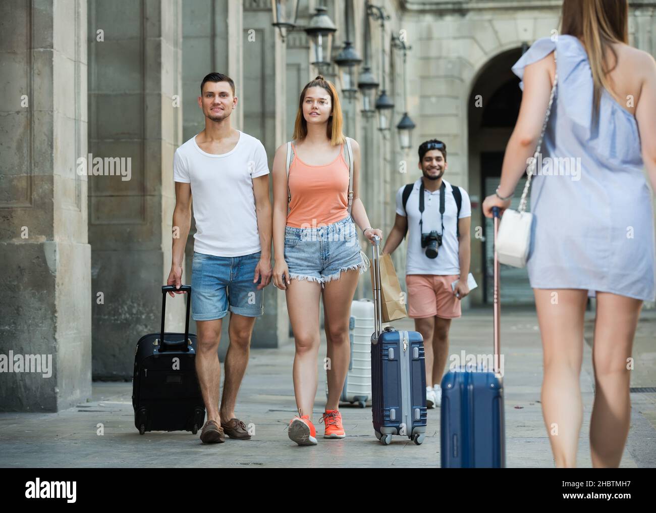 Travelers taking walk in town Stock Photo - Alamy