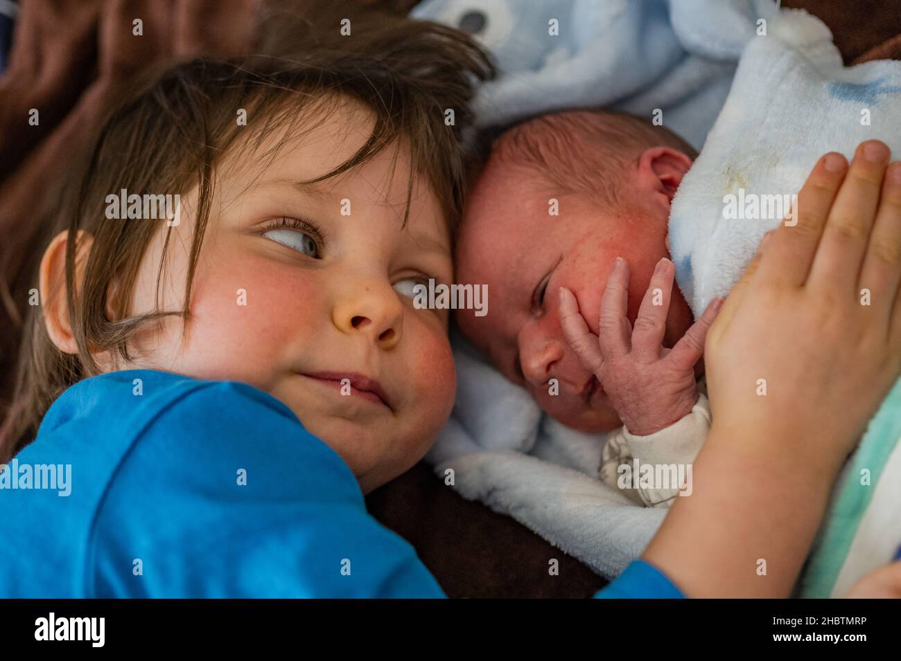 A young girl and her newborn brother Stock Photo - Alamy