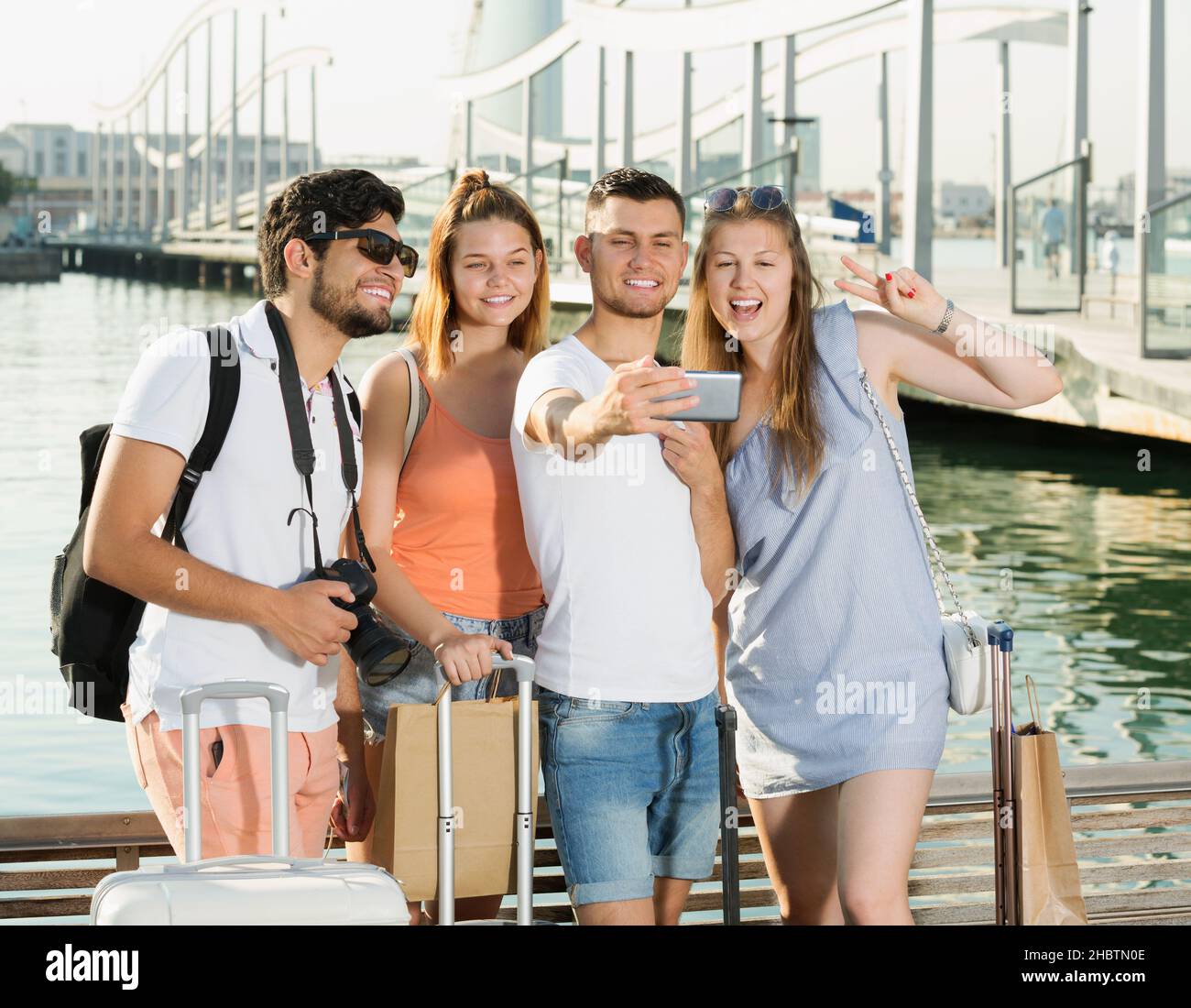 Happy friends travellers smiling and making selfie Stock Photo - Alamy