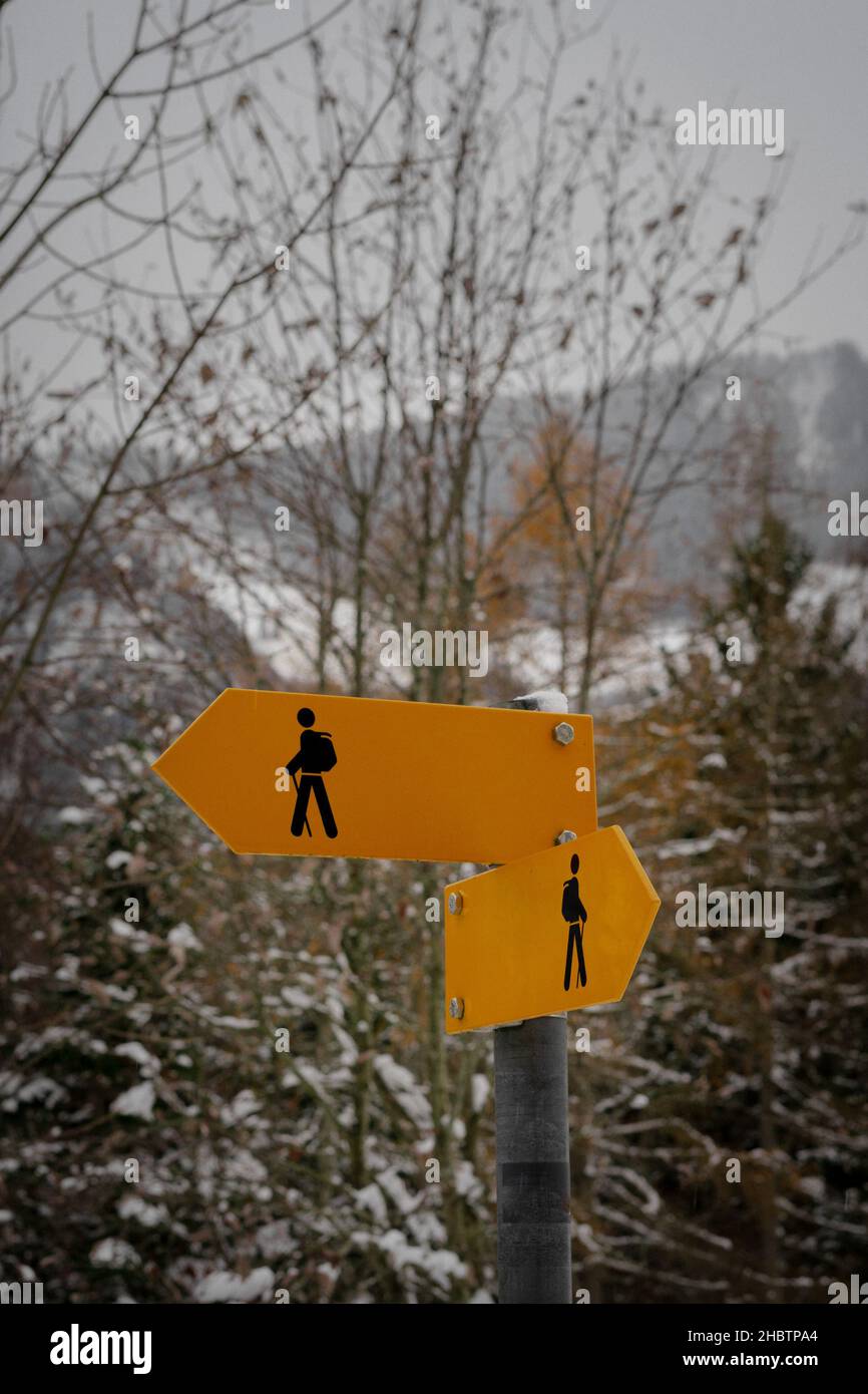 yellow hike sign on snowy mountains background Stock Photo - Alamy