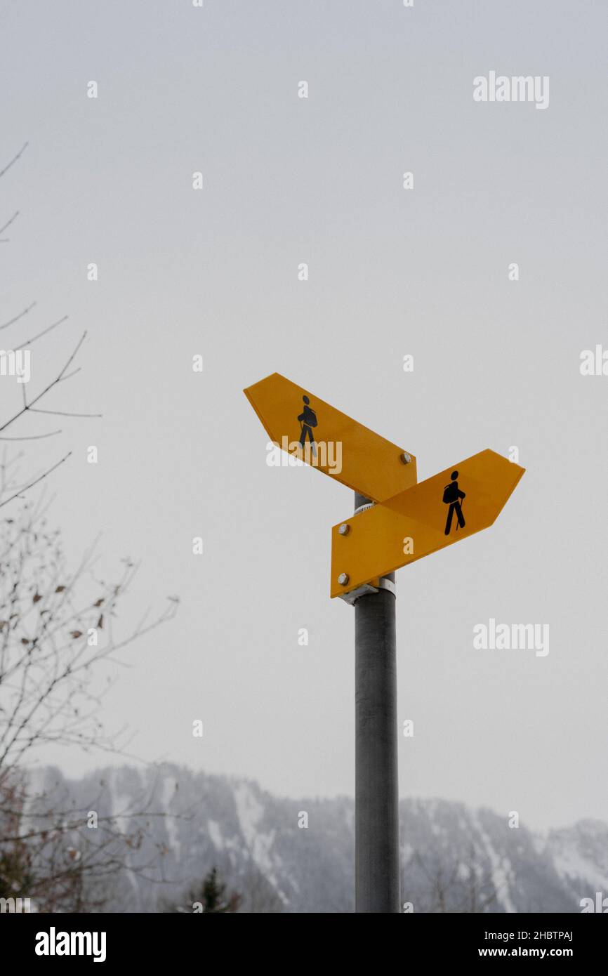 yellow hike sign on snowy mountains background Stock Photo - Alamy