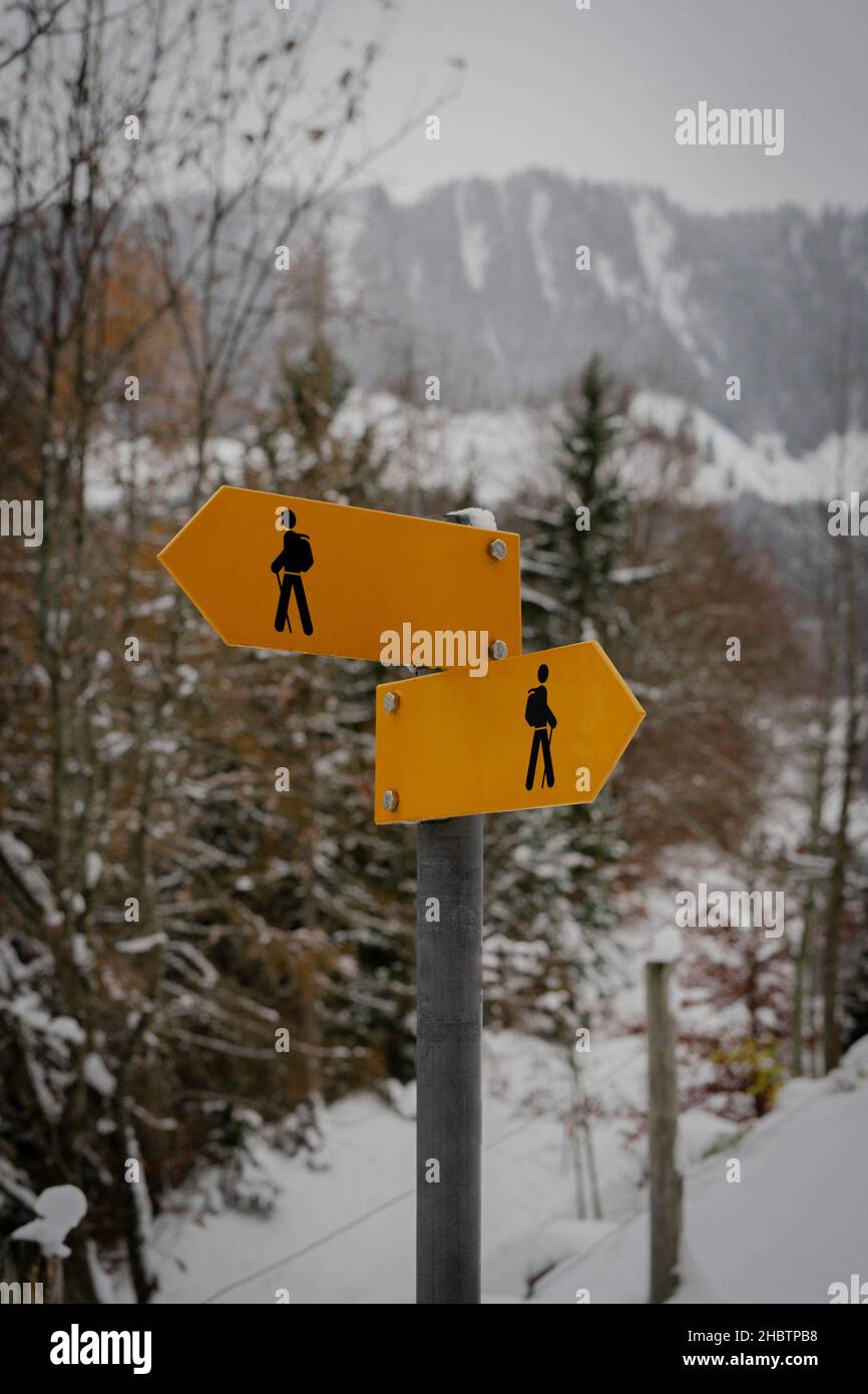 yellow hike sign on snowy mountains background Stock Photo - Alamy