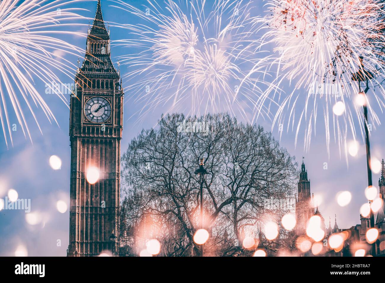 Big Ben with fireworks - celebrating the New Year in London Stock Photo ...