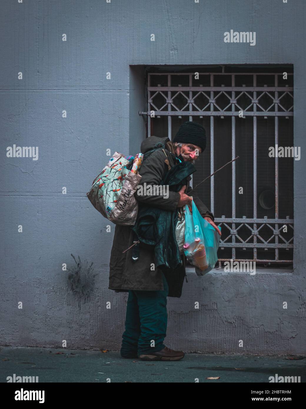 BUCHAREST, ROMANIA - Oct 18, 2021: A closeup of an old Homeless man on ...