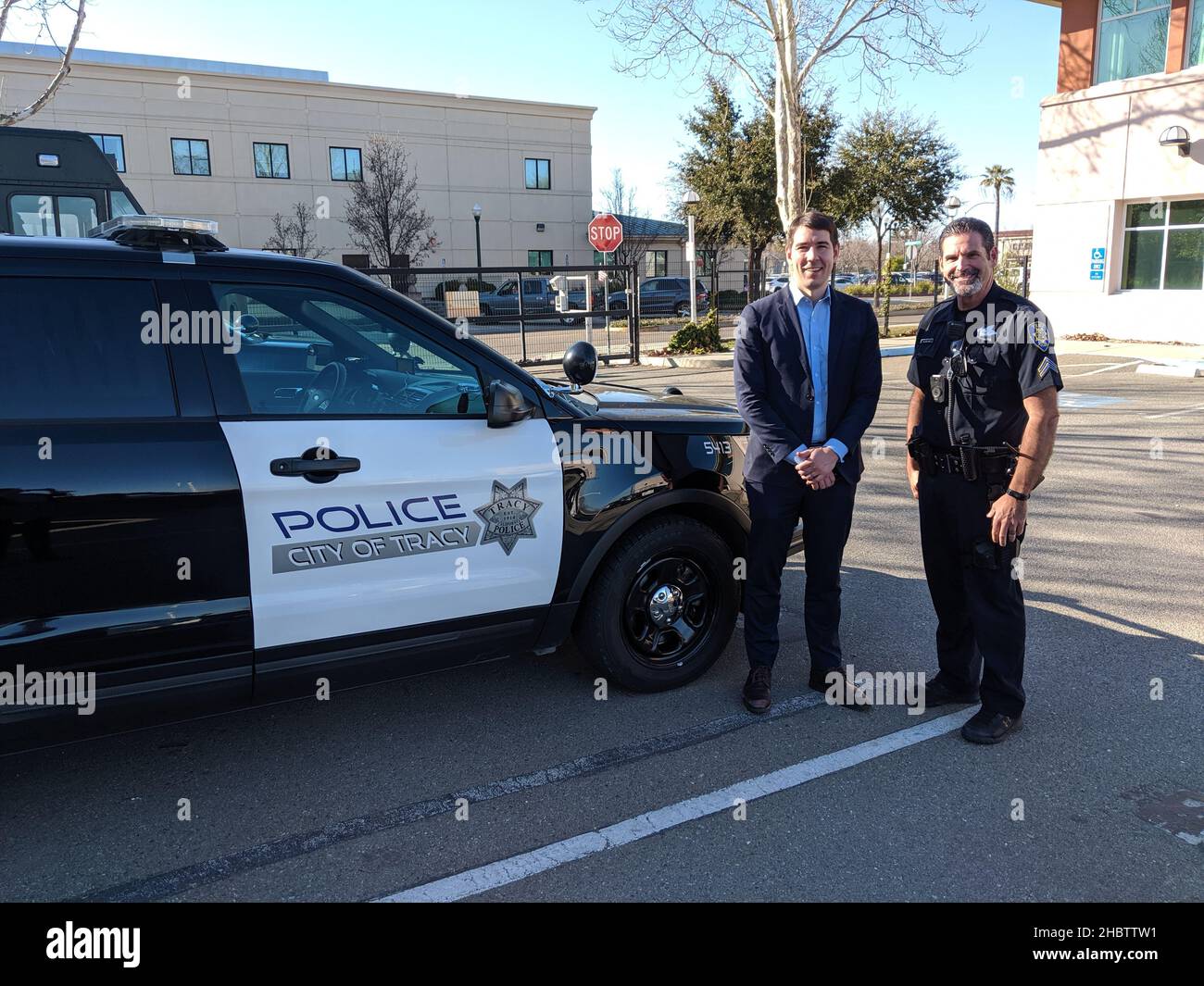 Josh Harder with a Tracy police officer ca. 20 February 2020 Stock ...