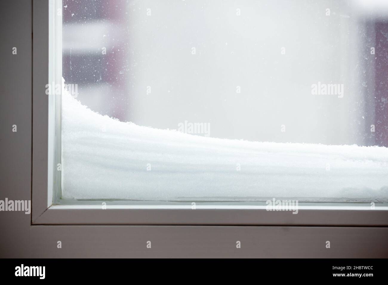 Snow covered window in a house after heavy snowfall Stock Photo - Alamy