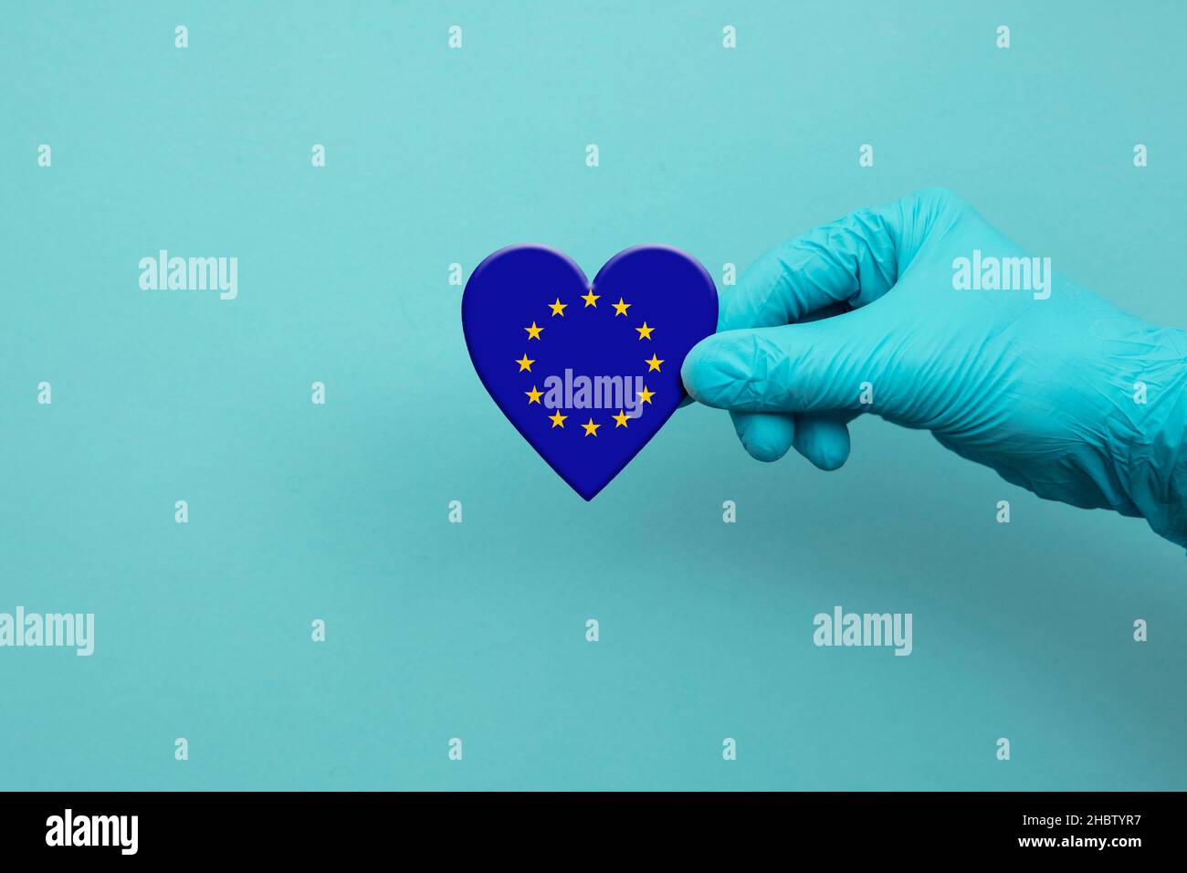 Medical workers hand wearing surgical glove holding European Union flag ...
