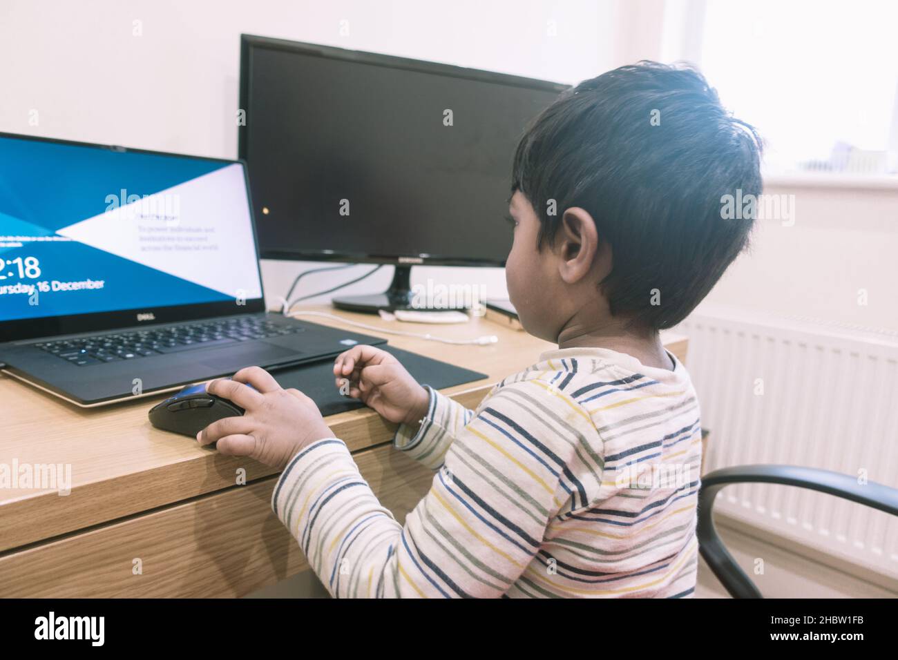 Child operating an unattended computer Stock Photo - Alamy