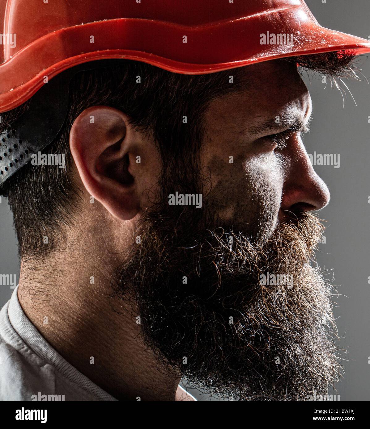 Building, industry, technology - builder concept. Bearded man worker ...