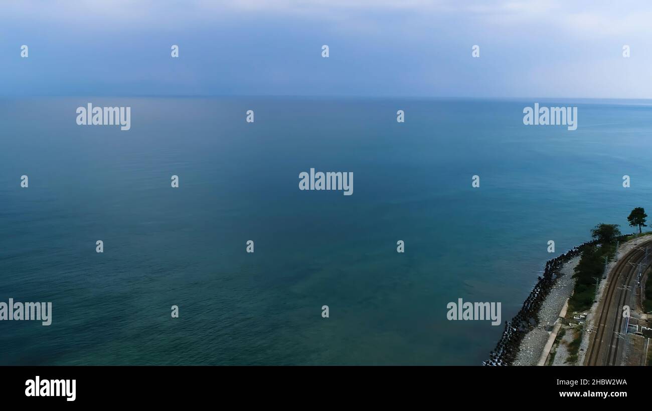 Stunning aerial view of the endless turquoise ocean with the line of ...