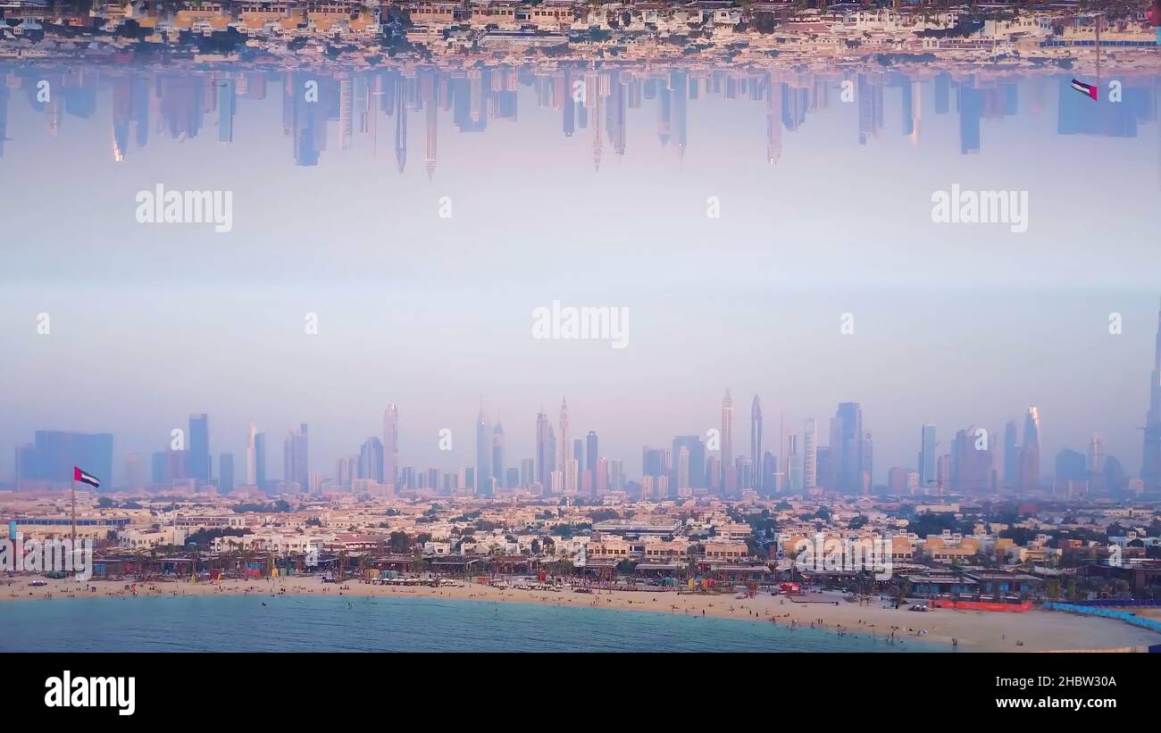 Aerial view of sandy coast, beautiful sea on modern skyscrapers ...