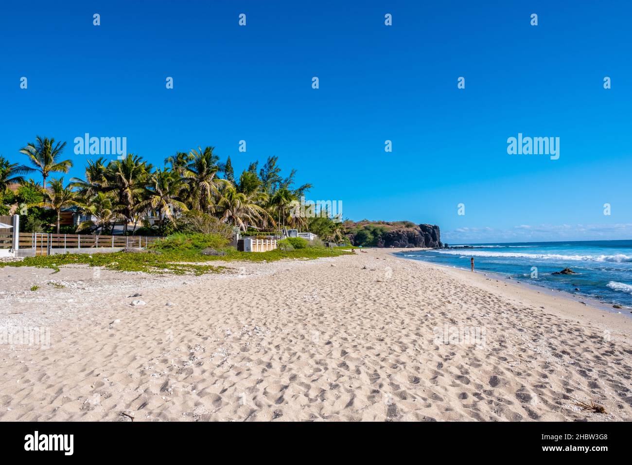A bright summer day at a beach in Saint Paul in Reunion, France with ...