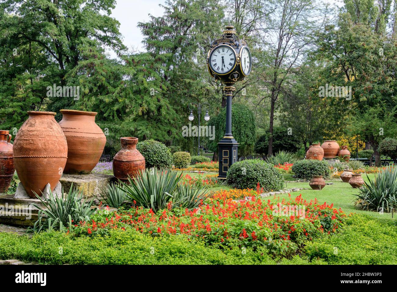 Landscape with the main entrance with vivid flowers and green plants ...