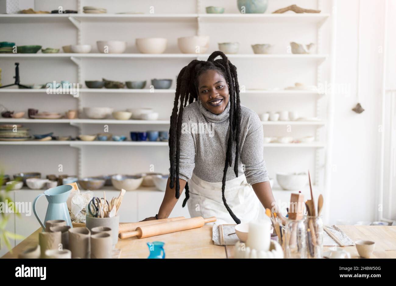 Woman pottery artist working in her art studio Stock Photo - Alamy