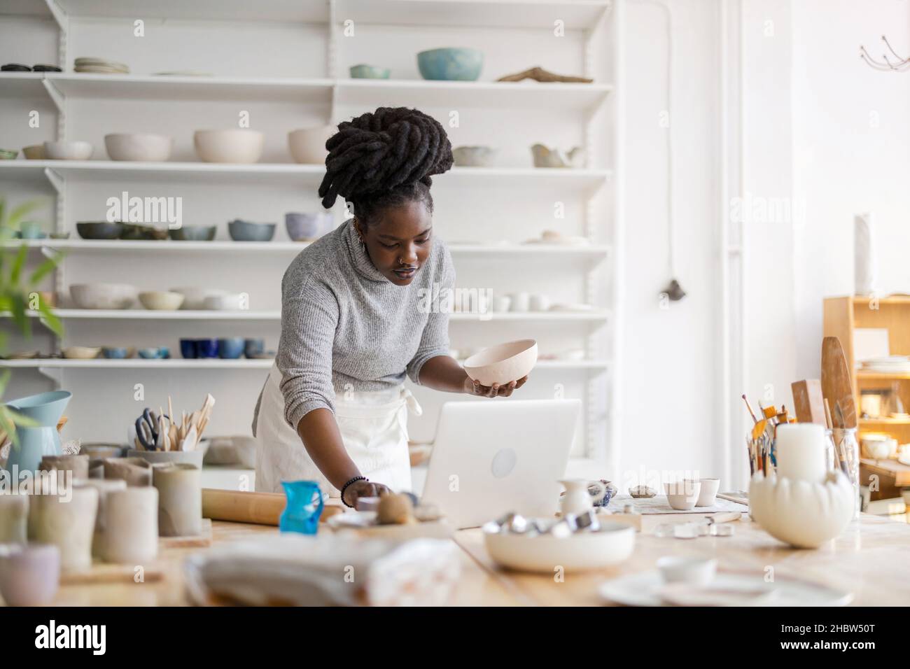Woman pottery artist working in her art studio Stock Photo - Alamy