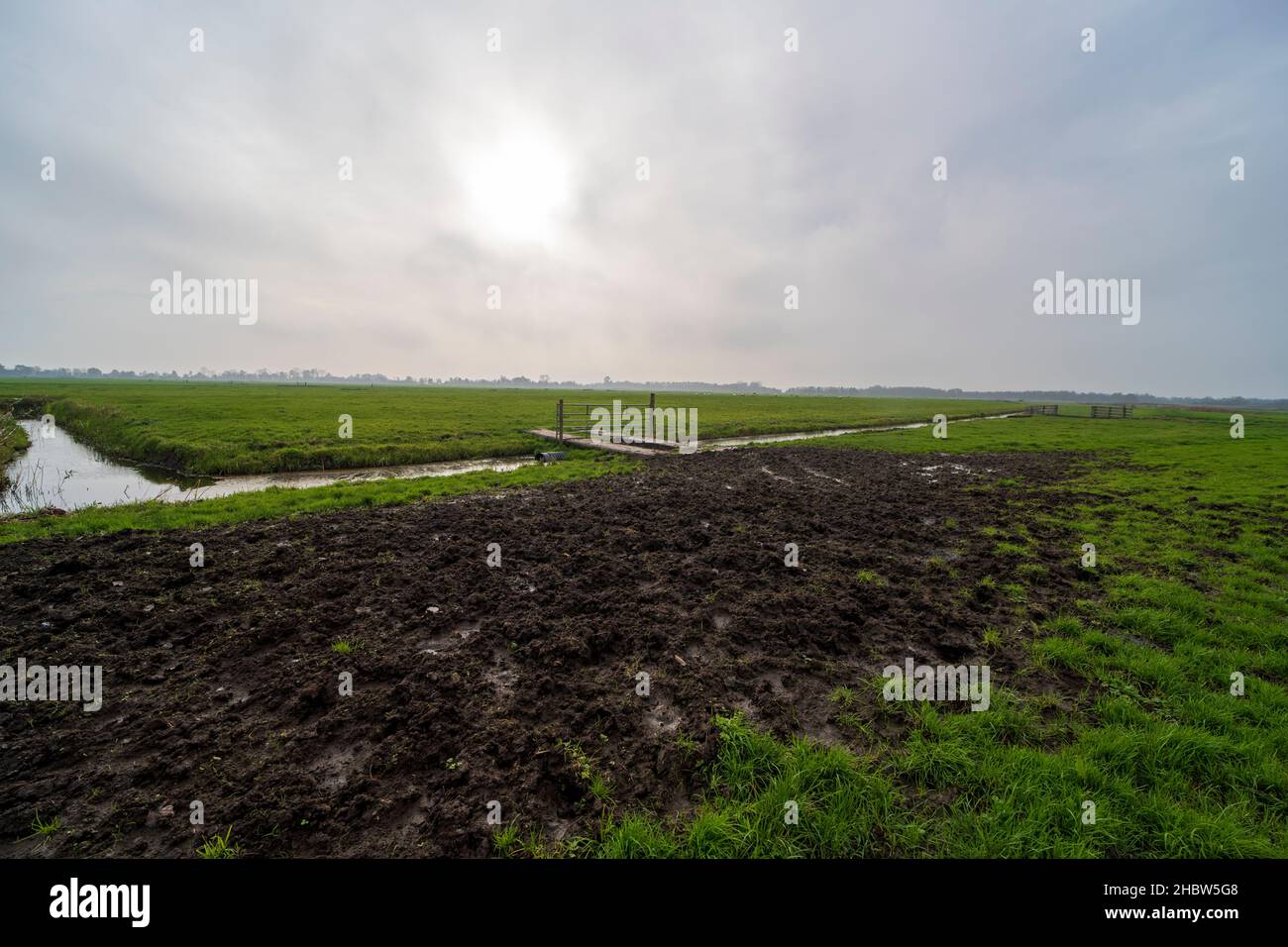 Landscape picture of a ditch and farmlands Stock Photo - Alamy