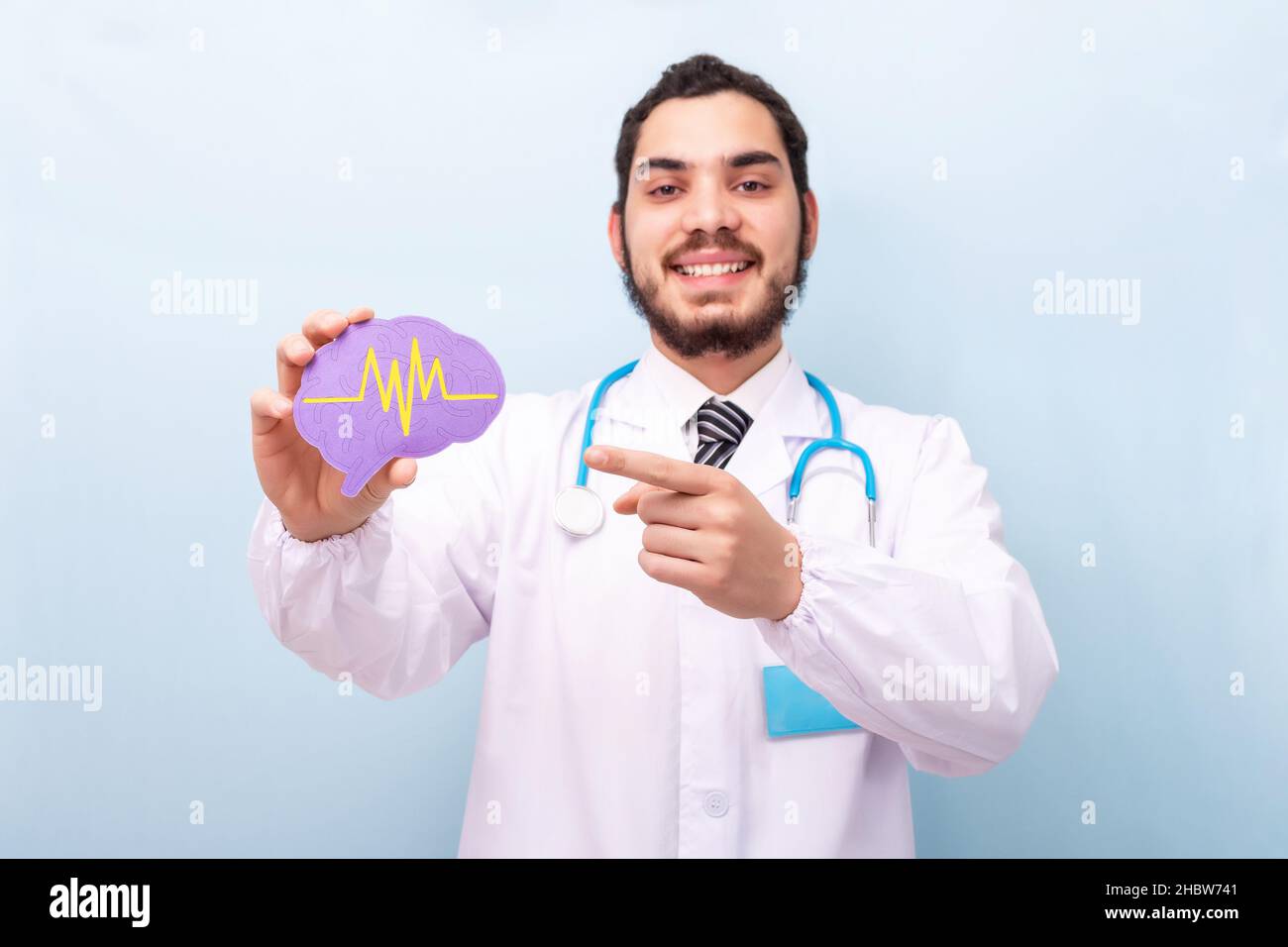 A doctor neurologist holding a human brain figure Stock Photo - Alamy