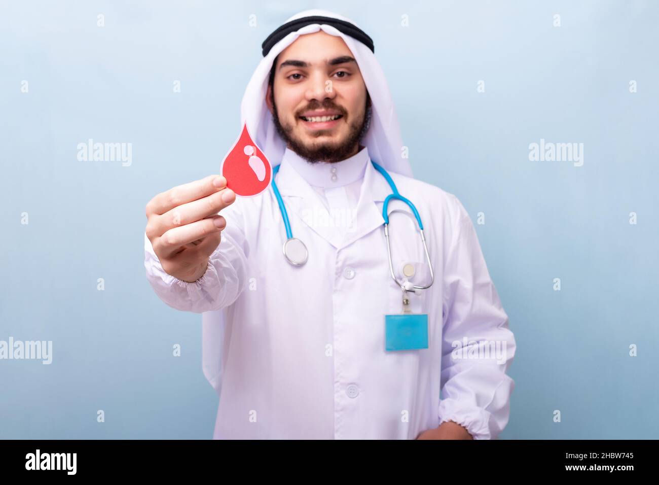 A saudi doctor shows the figure of a drop of blood Stock Photo - Alamy