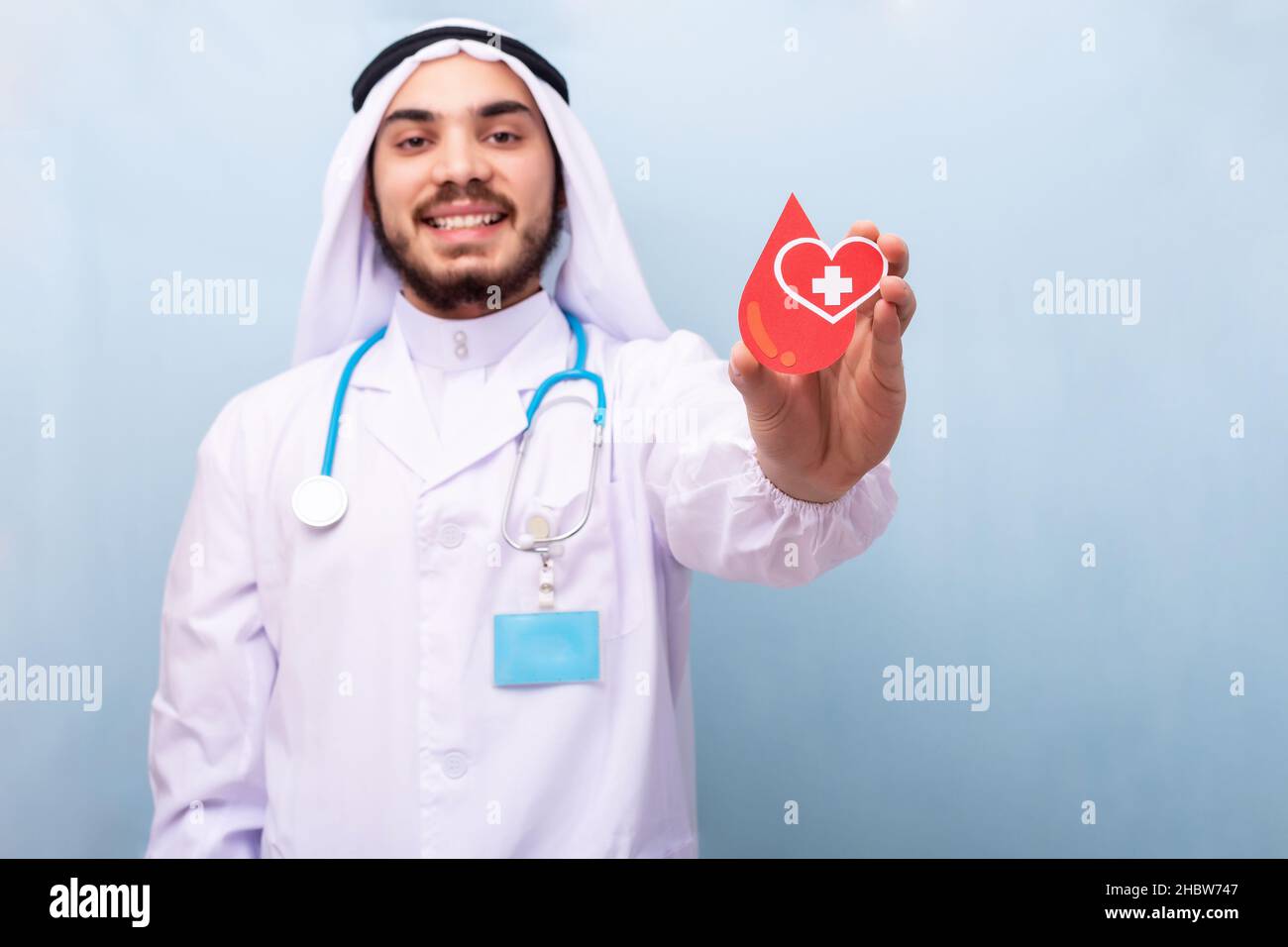 A saudi doctor shows the figure of a drop of blood Stock Photo - Alamy