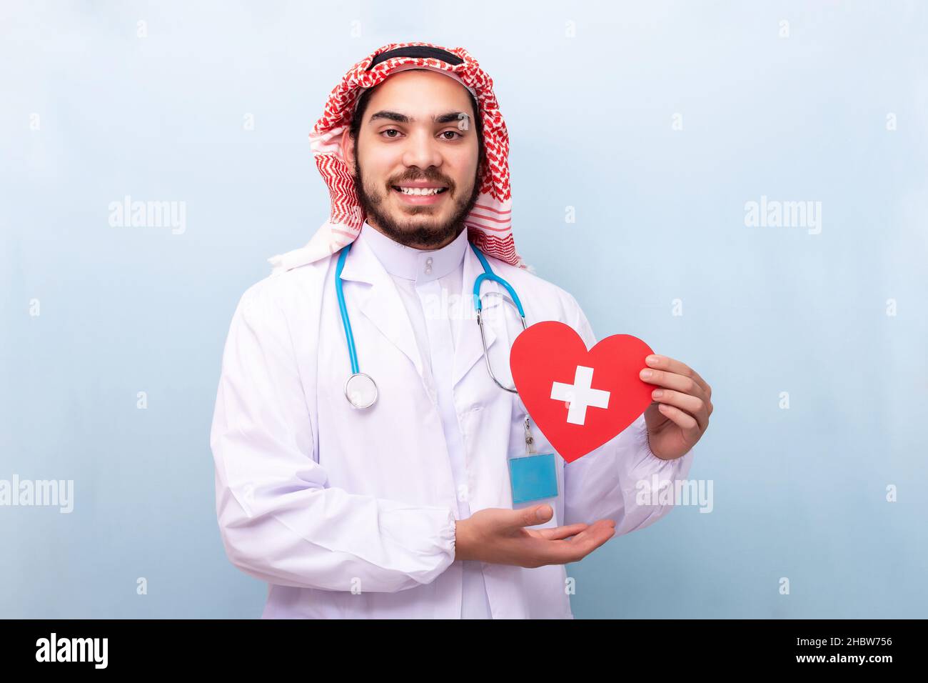 A man holding a heart shape sign Stock Photo - Alamy