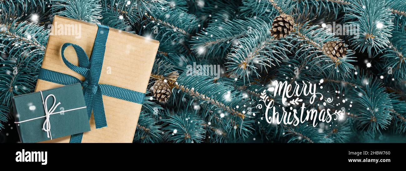 New Year banner. Presents on blue christmas tree background Stock Photo ...