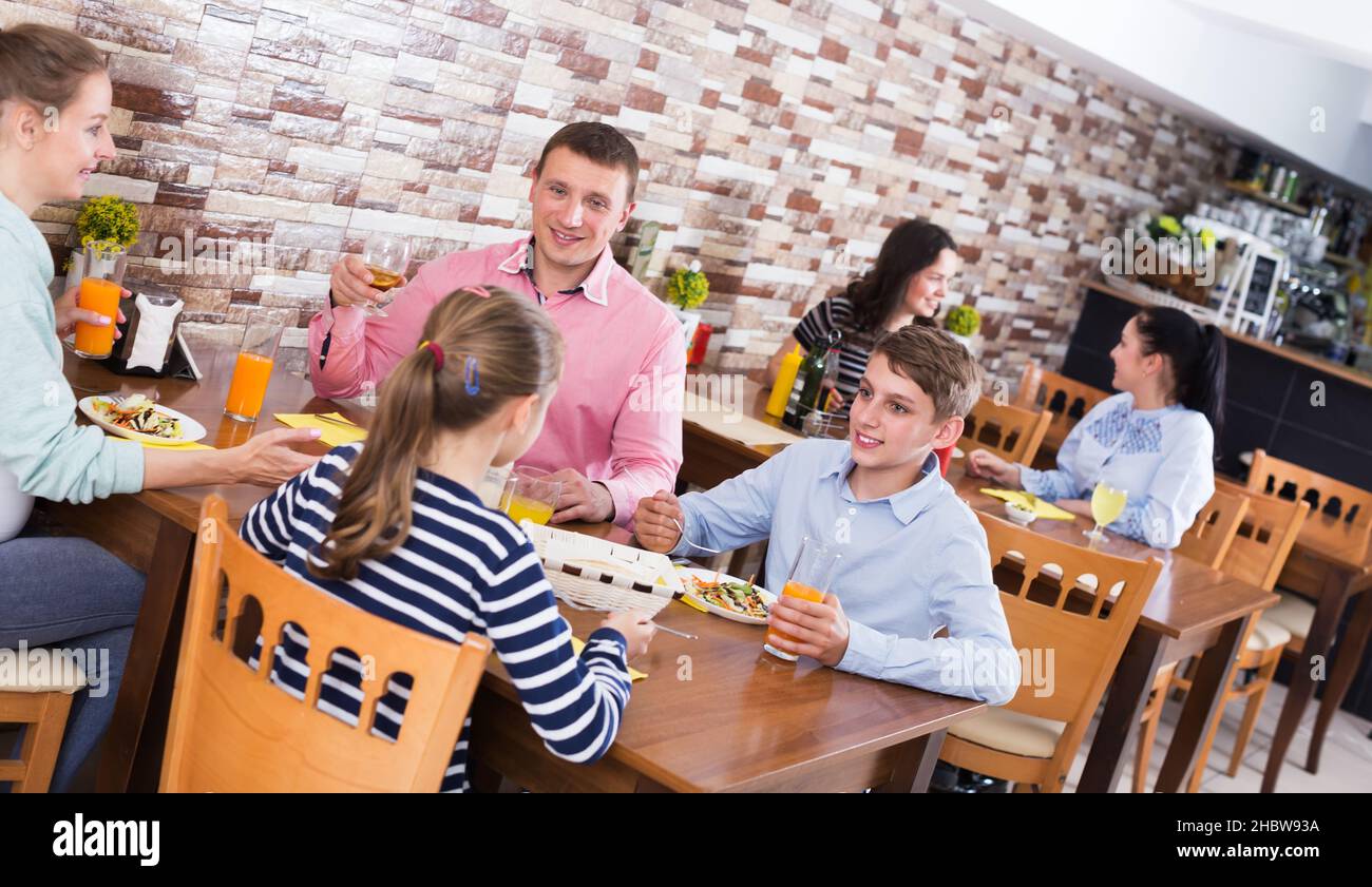 Family dining in cafe Stock Photo - Alamy
