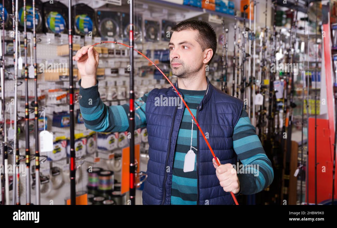 Young fisherman choosing fishing hi-res stock photography and images ...