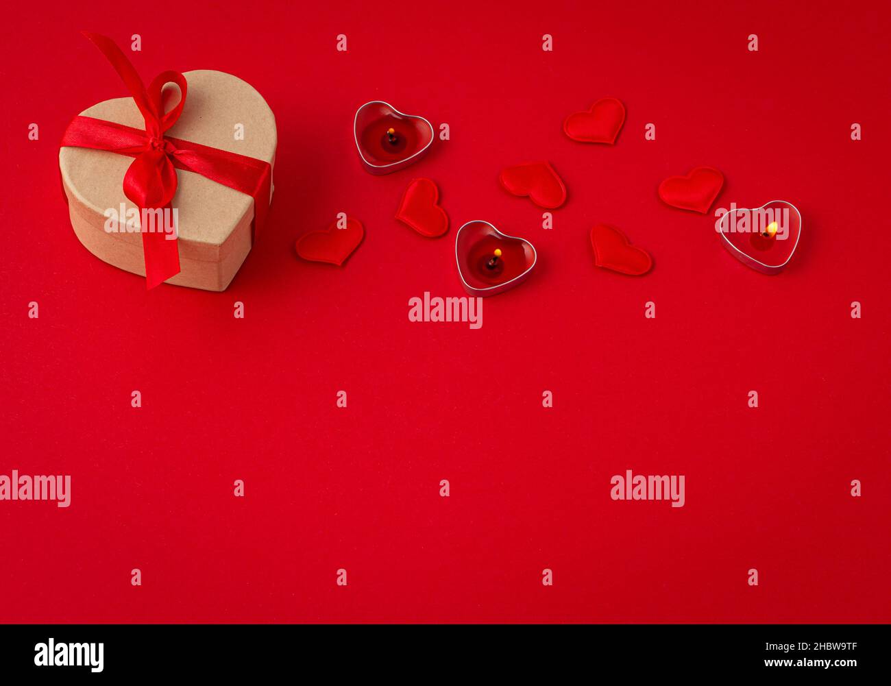 Saint Valentine top view composition with gift box, candles, hearts on ...