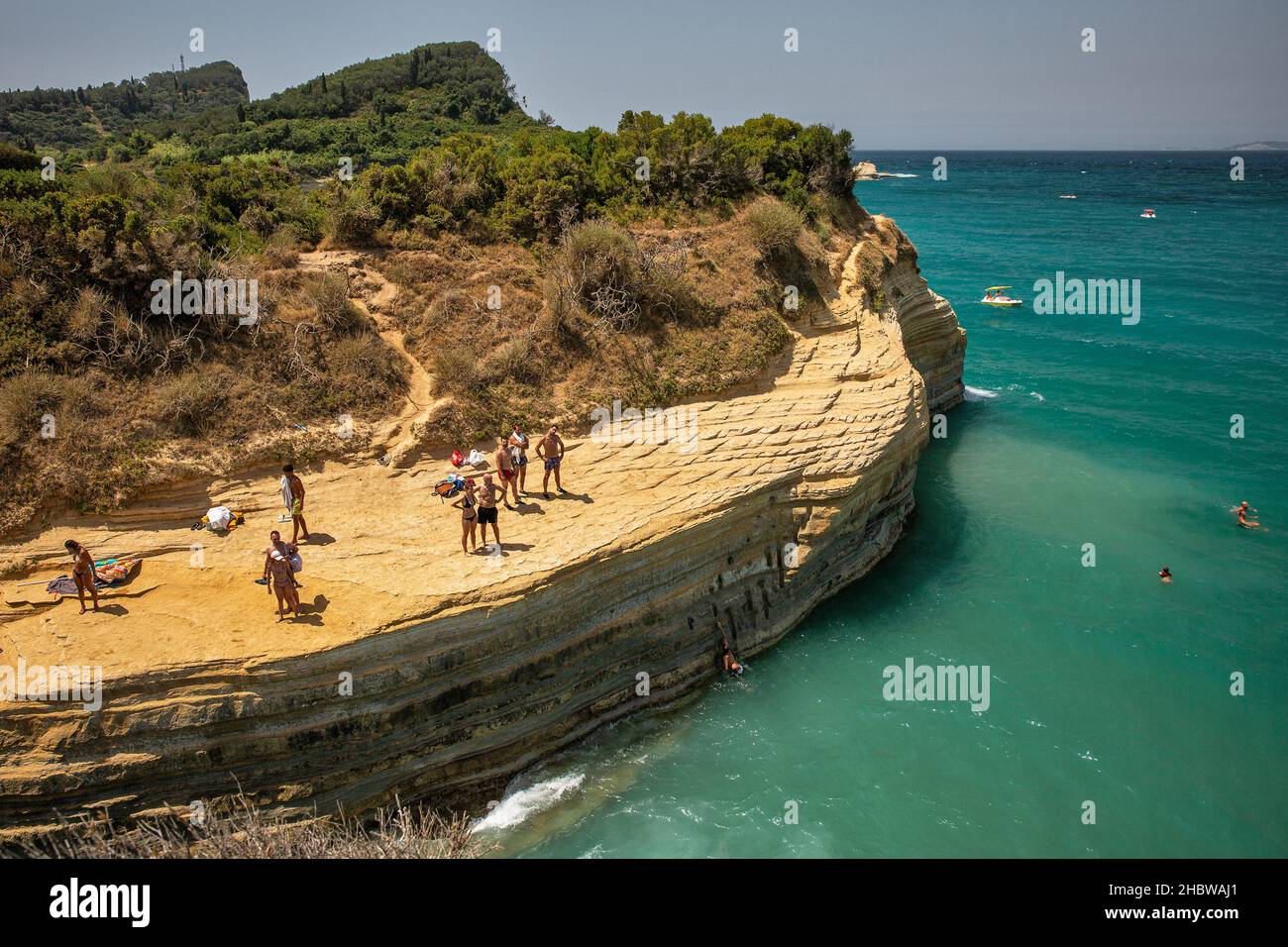 Sidari, Corfu, Greece - August 01, 2021: People swim and sunbath in ...