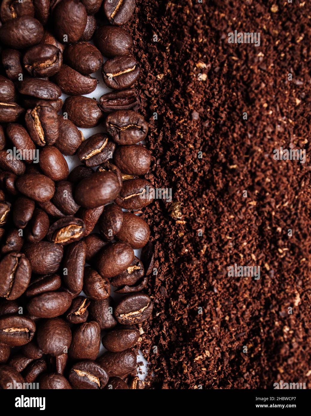 A vertical closeup of ground coffee and roasted coffee beans Stock ...