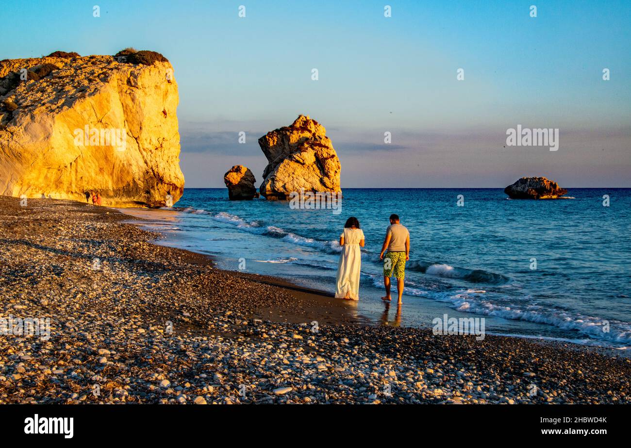 A young couple on Petra tou Romiou beach, Cyprus Stock Photo - Alamy