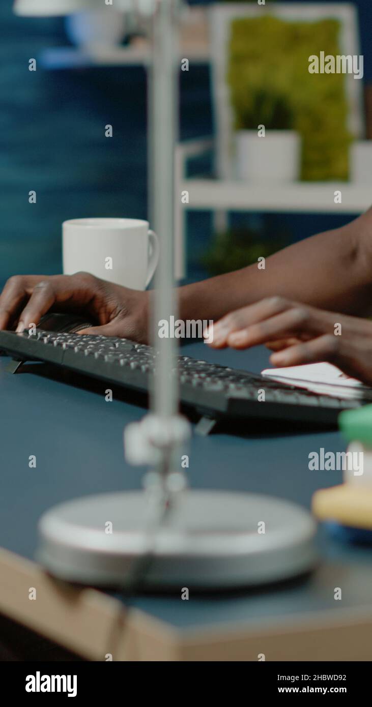 Close up of architect using keyboard and computer for building design ...
